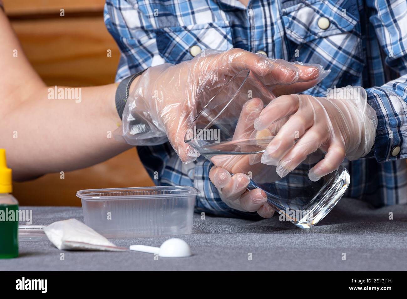 Chemistry education and study concept. Close-up of a boy and his mother ...