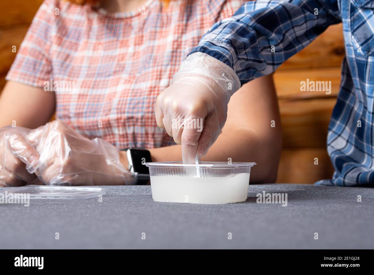 Chemistry education and study concept. Close-up of a boy stirring a ...