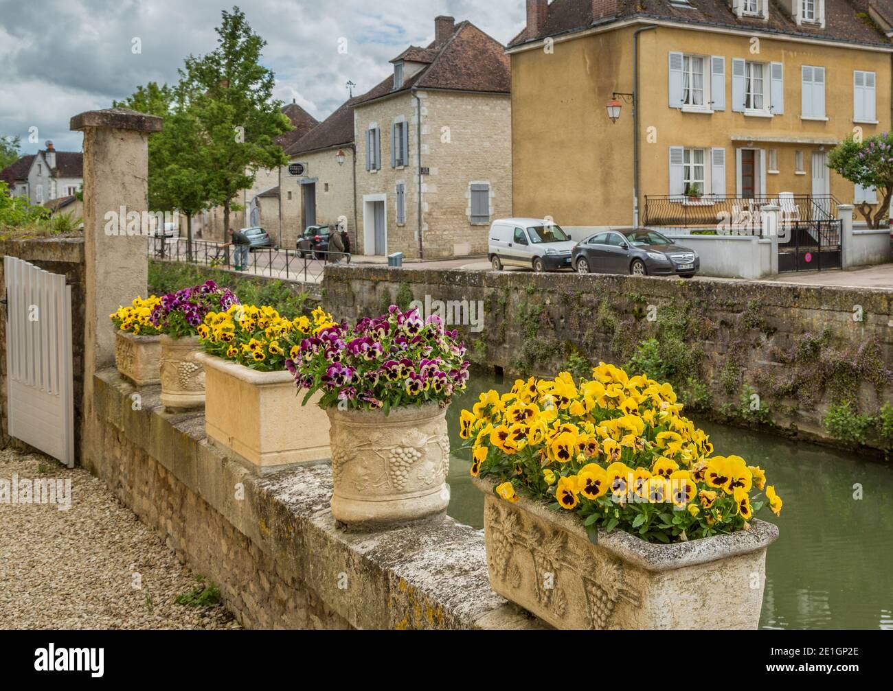 Planter and flowers in the beautiful town of Chablis, Burgundy, France ...