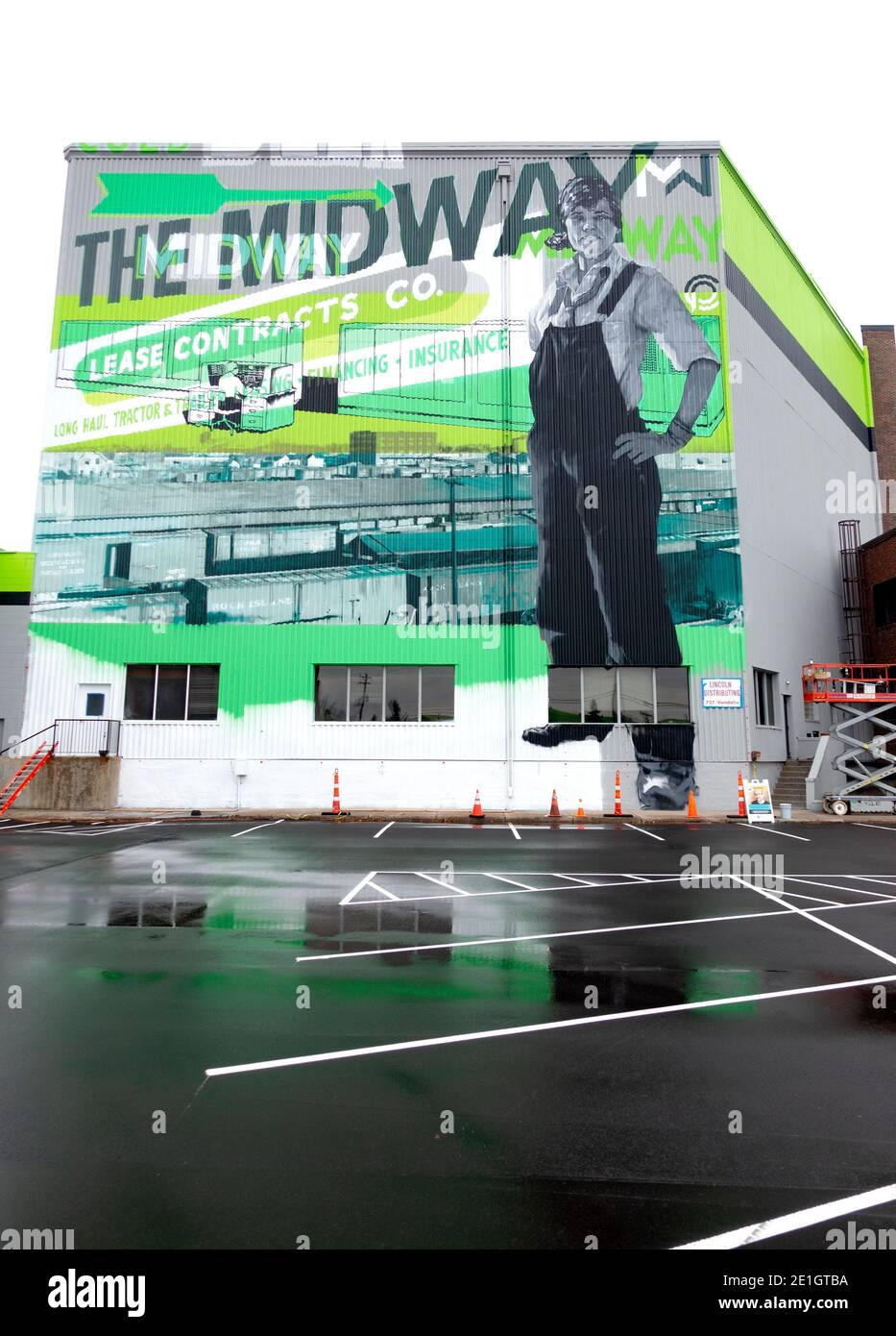 Giant painting on building wall advertising employment, lease contracts ...