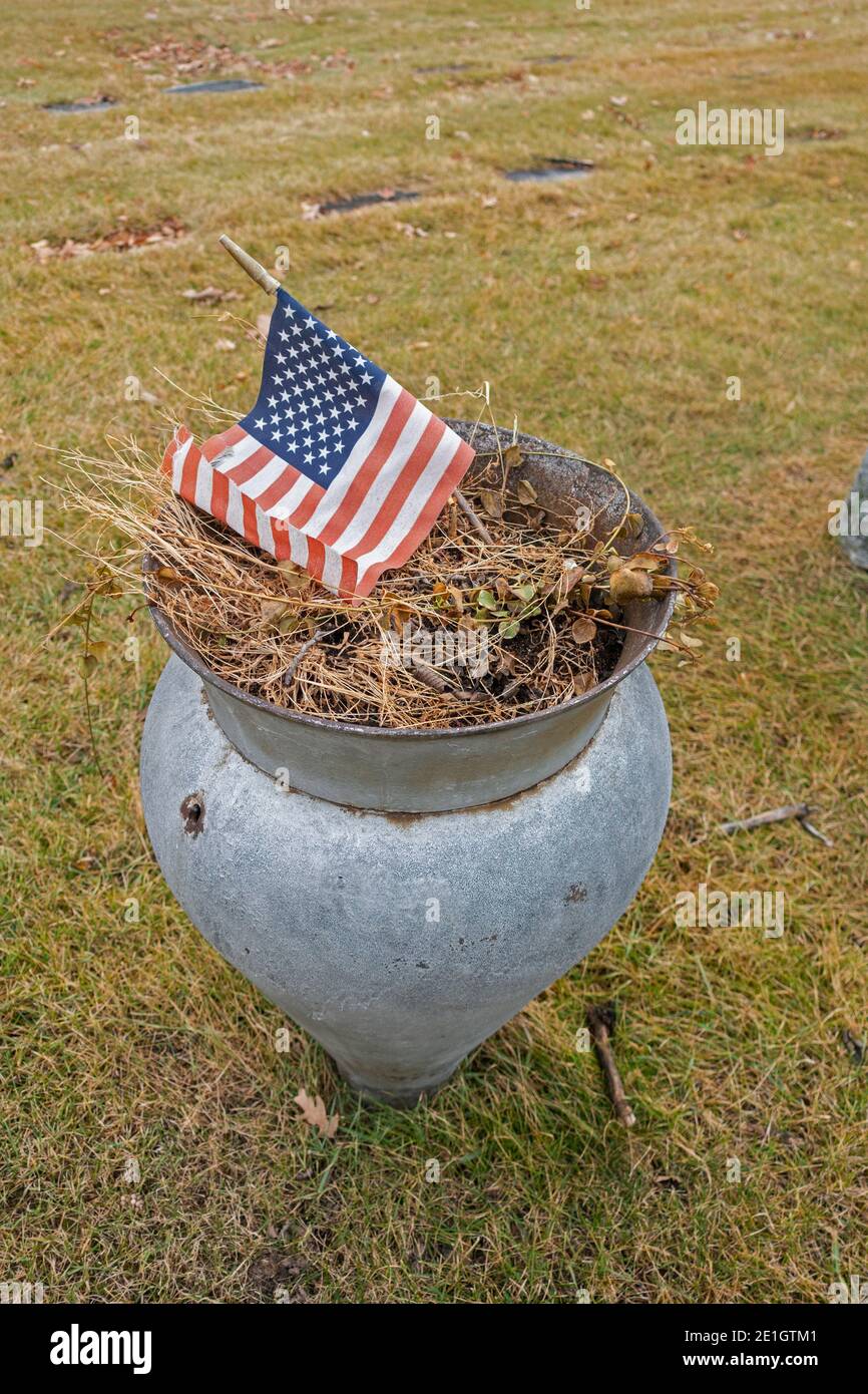 Sad planter with dead plant and American flag at Crystal Lake Cemetery ...