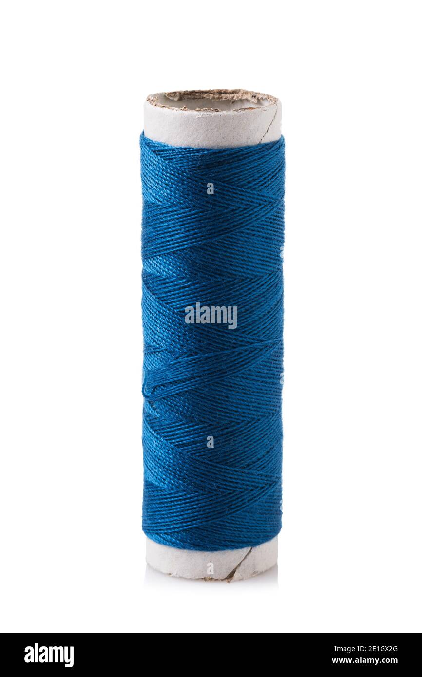 Spool of thread in blue isolated on white background Stock Photo - Alamy