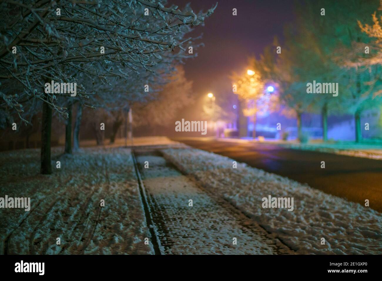 Night city street in winter snowy weather Stock Photo - Alamy