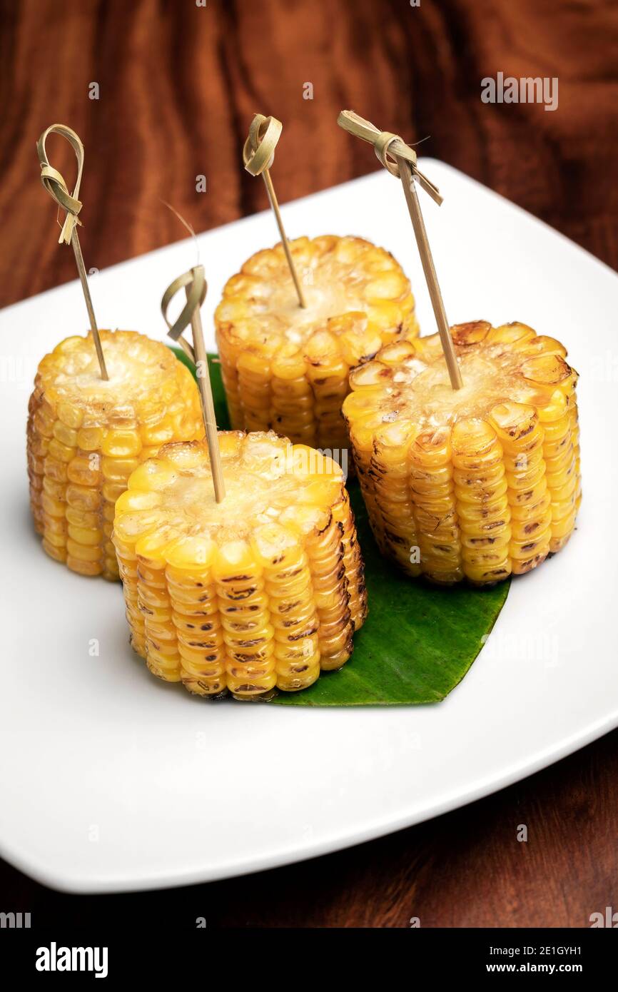 sweet corn on the cob vegetarian tapas snack food Stock Photo - Alamy