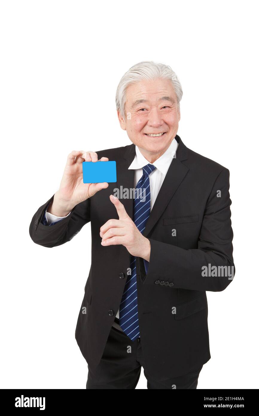 An old senior businessman holding name card high quality photo Stock ...