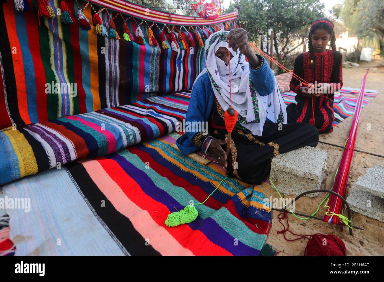 Gaza. 6th Jan, 2021. Palestinian Bedouin woman Hosnia Al-Dabji makes an ...