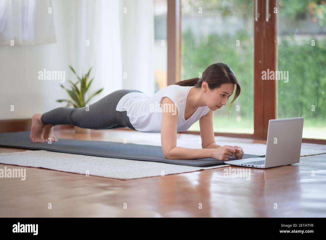 Beautiful asian woman staying fit by exercising at home for healthy trend lifestyle Stock Photo ...