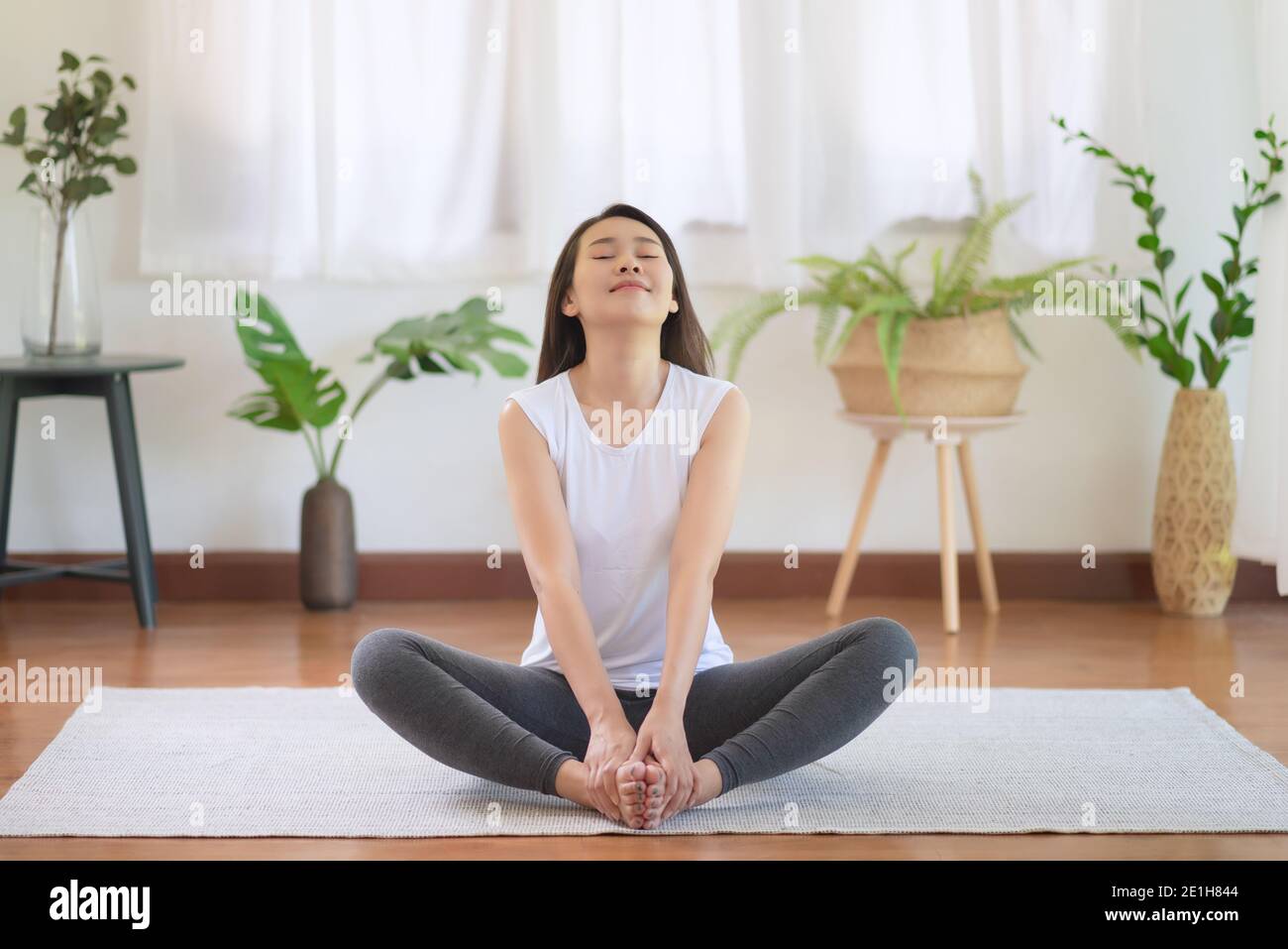 Beautiful asian woman staying fit by exercising at home for healthy trend lifestyle Stock Photo ...