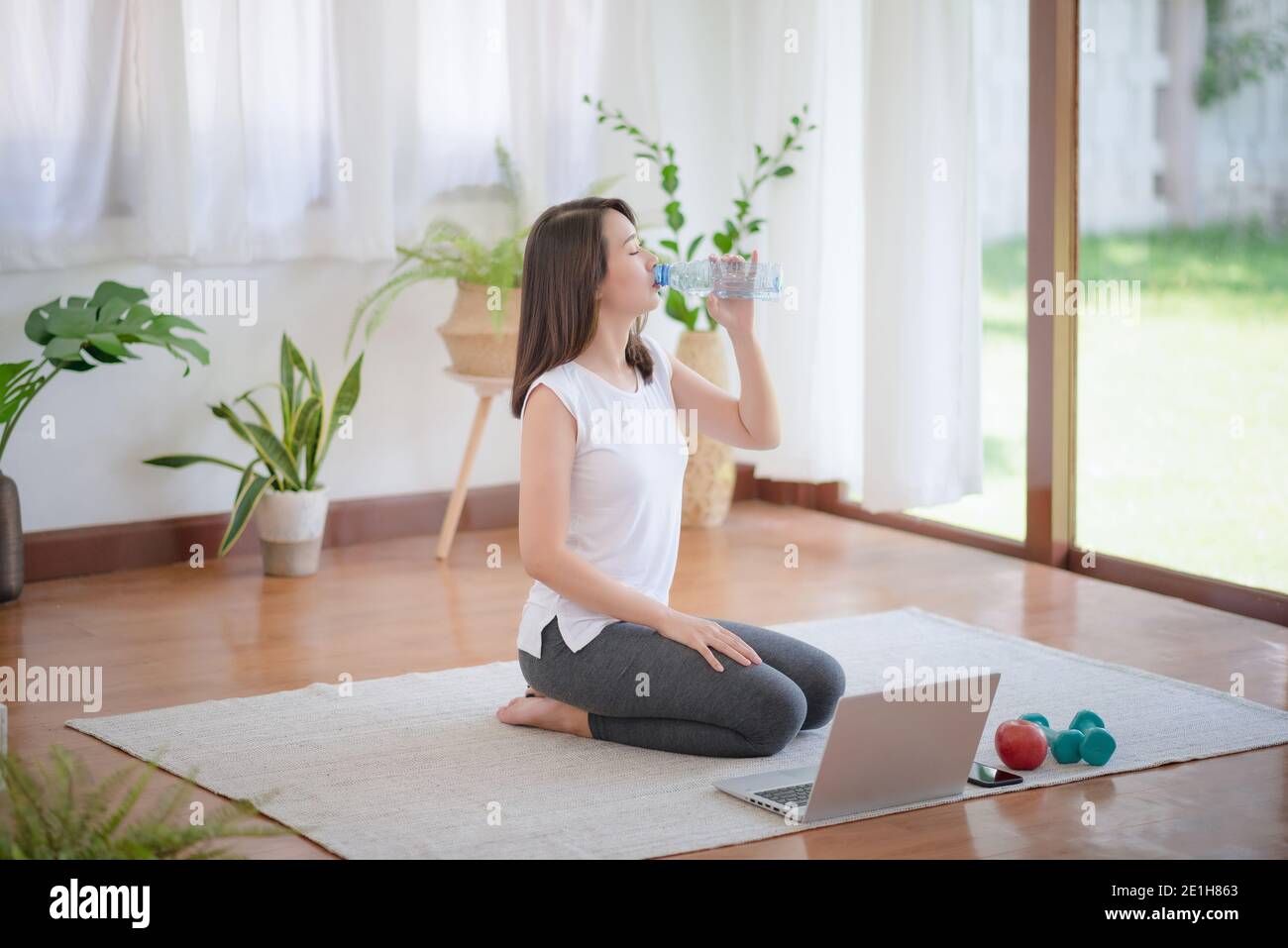 Beautiful asian woman staying fit by exercising at home for healthy trend lifestyle Stock Photo ...