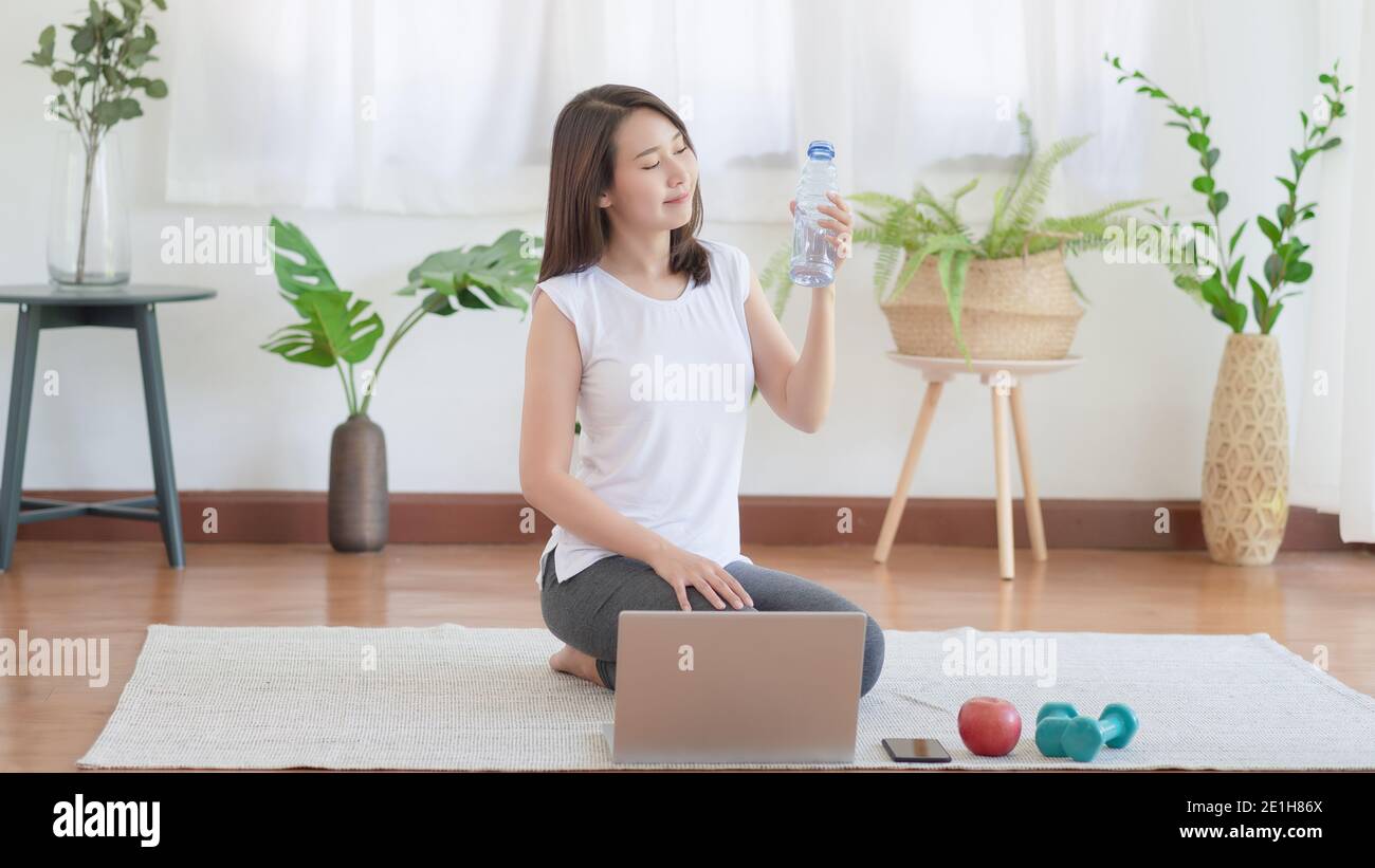 Beautiful asian woman staying fit by exercising at home for healthy trend lifestyle Stock Photo ...
