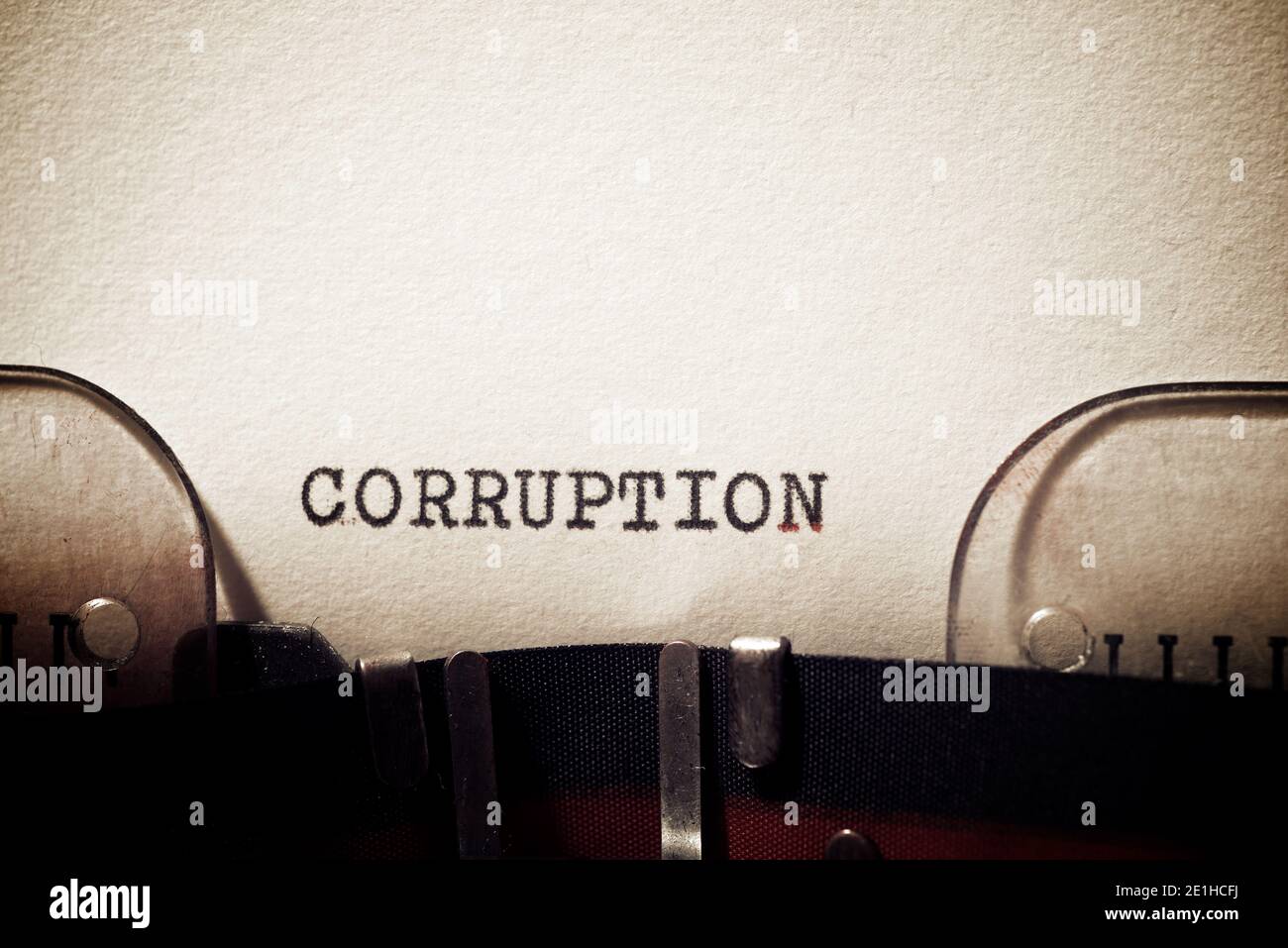 Corruption word written with a typewriter Stock Photo - Alamy