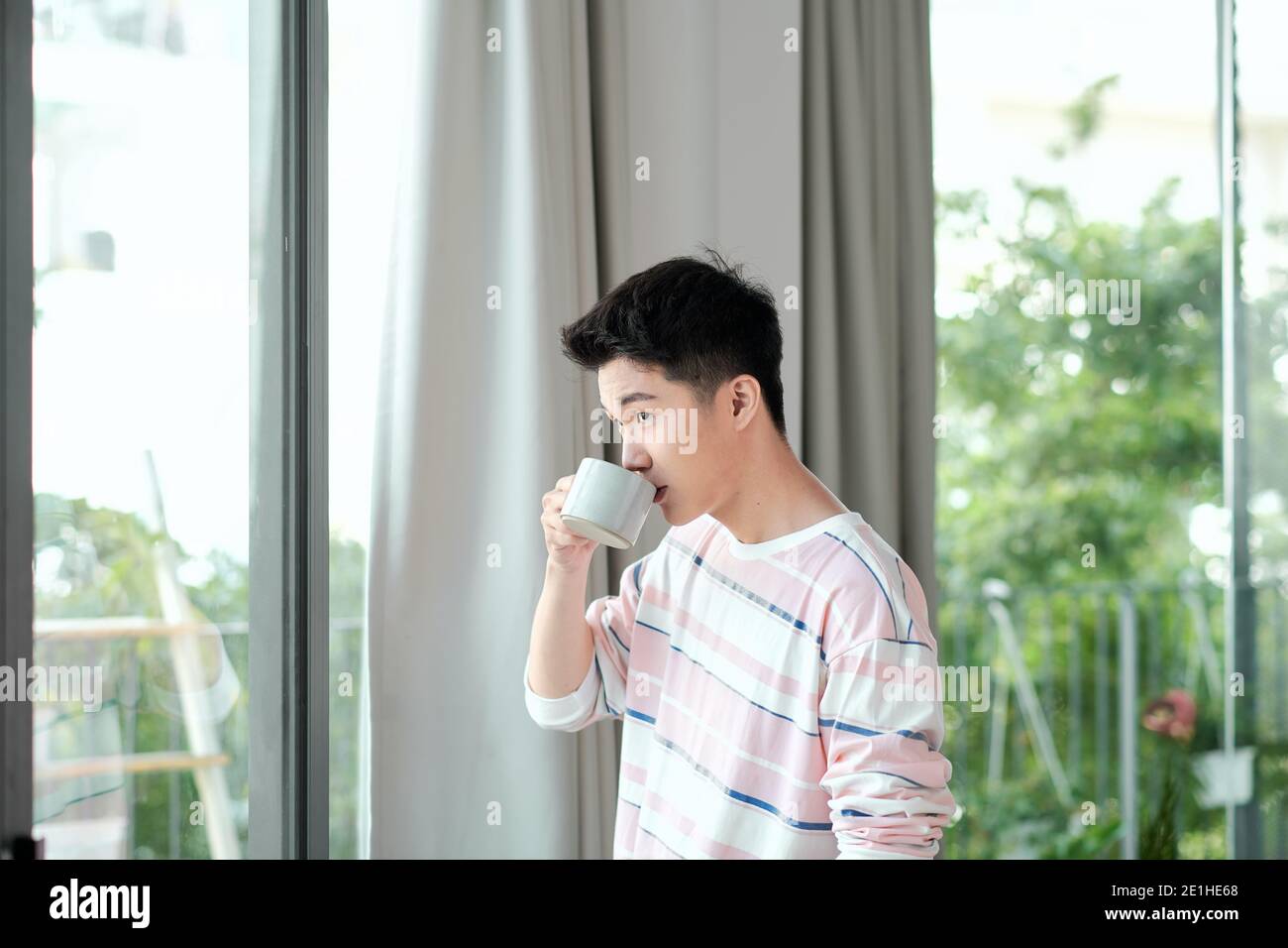 Handsome man drinking tea in hi-res stock photography and images - Alamy