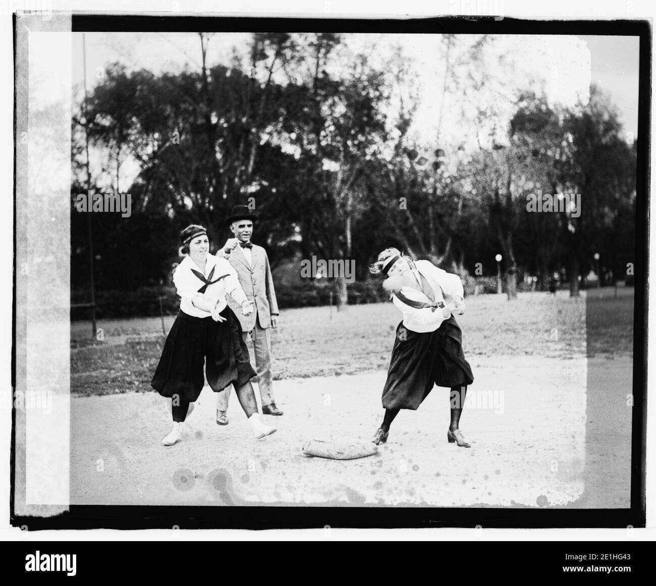 Lucile Boyd catching; Mary Cook at bat Stock Photo - Alamy