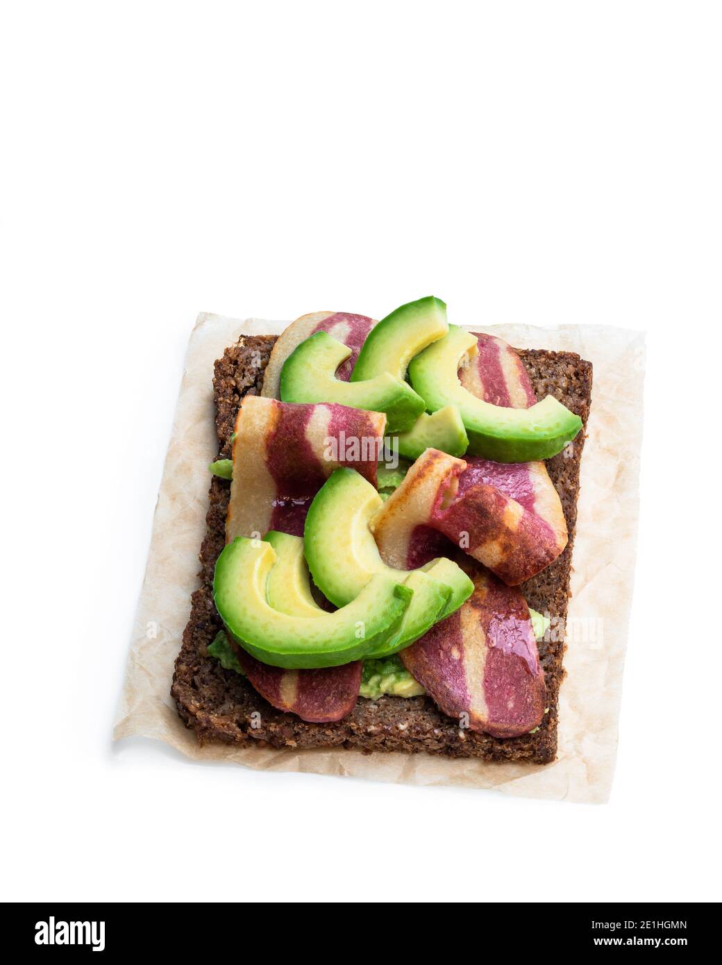 Sandwich with plant-based bacon rashers and avocado isolated on white ...