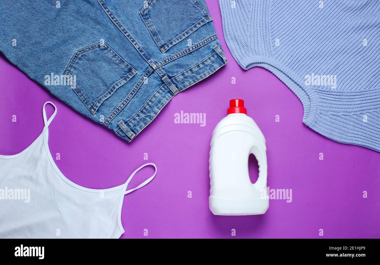 Minimalistic laundry concept. Things for washing, bottle of washing gel ...
