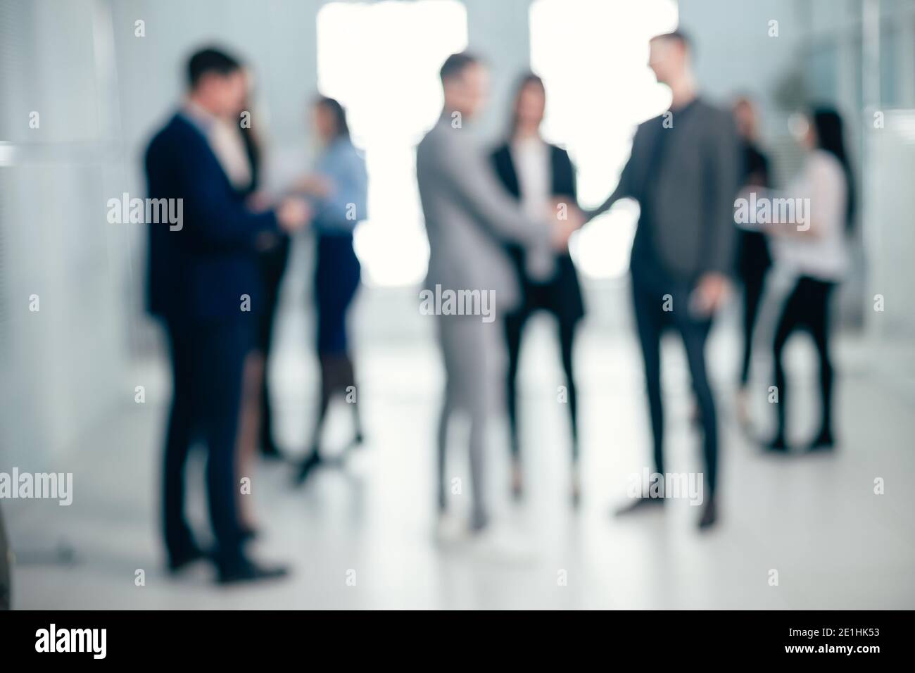 background image of a group of corporate employees in the office lobby ...