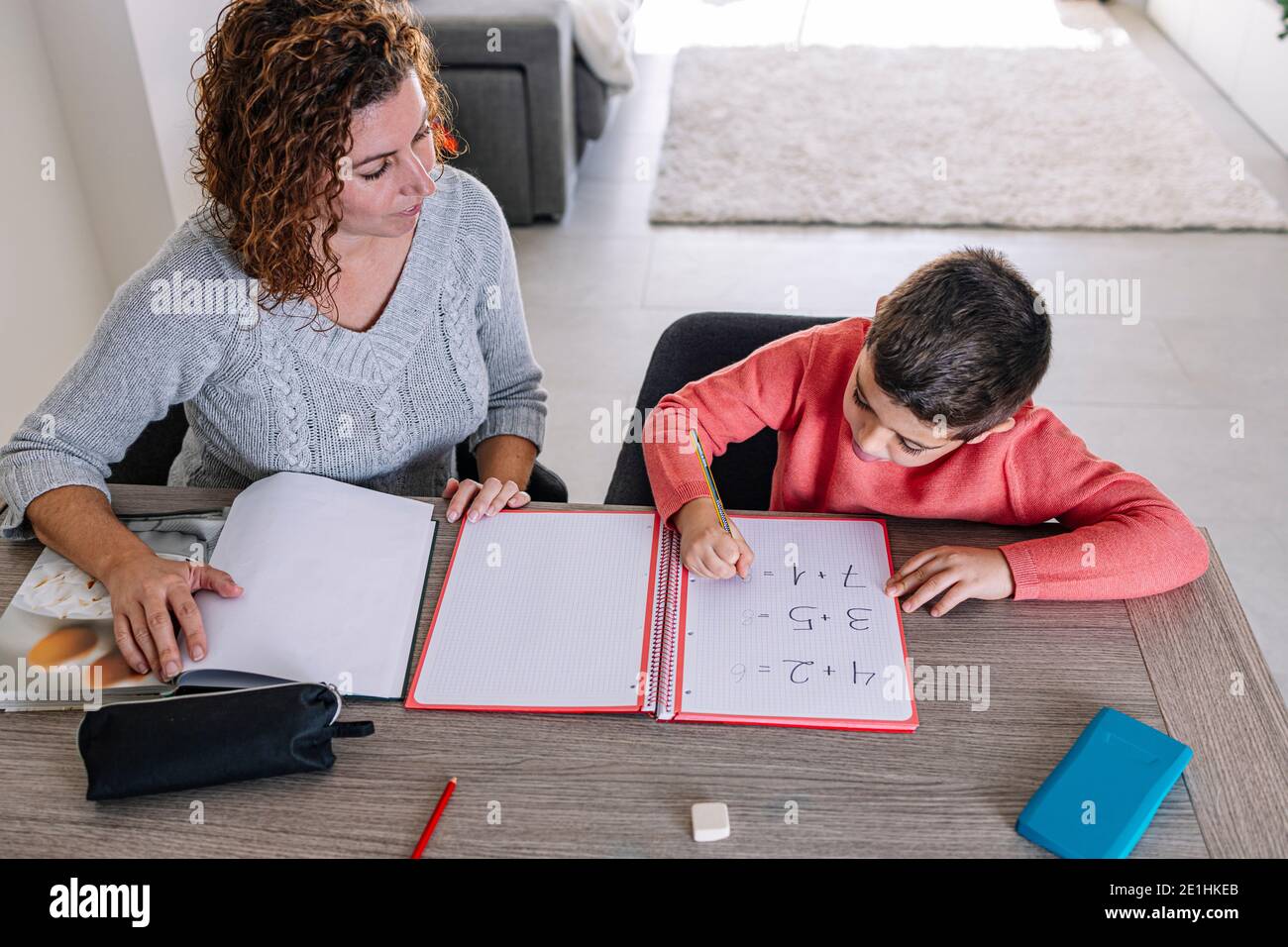 Parent helping child math homework hi-res stock photography and images ...
