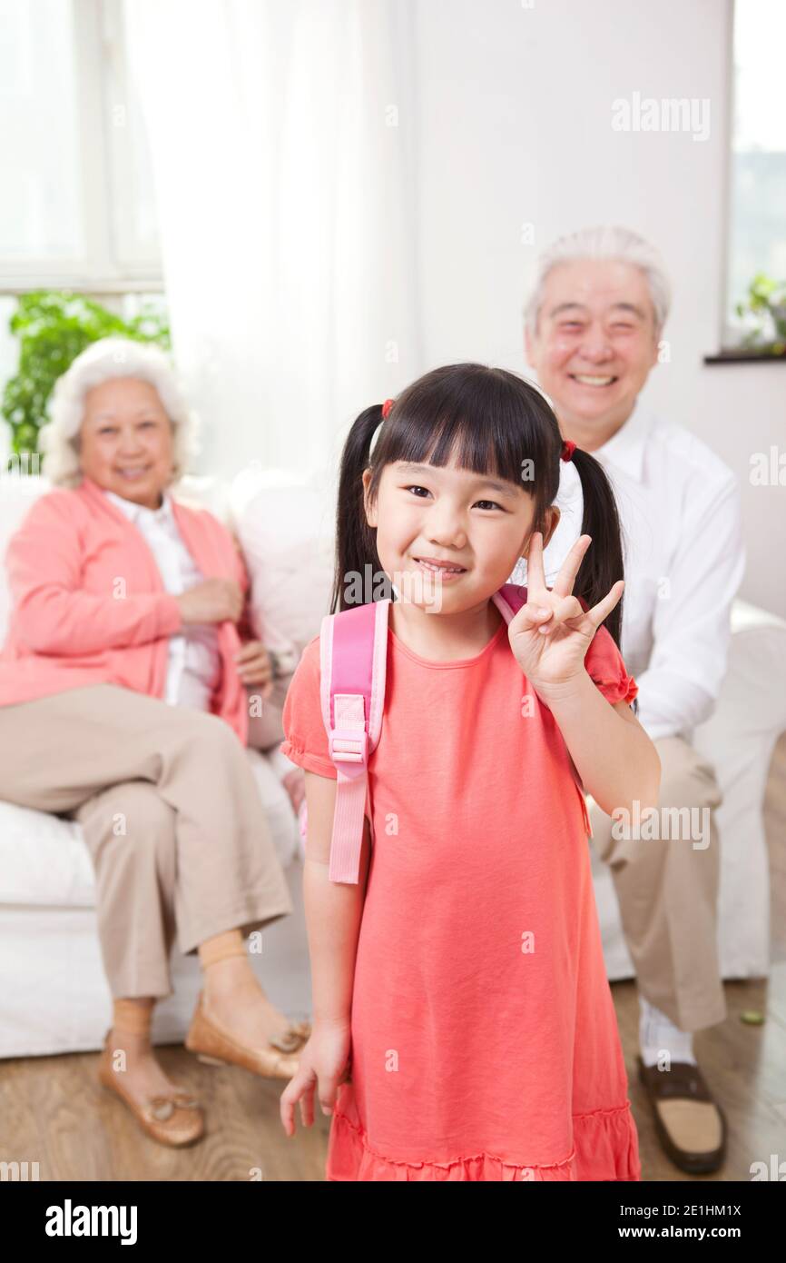 Happy grandparents and grandchildren are playing in the living room ...