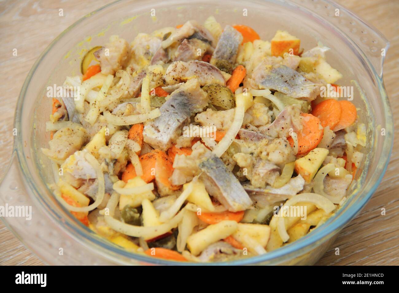 fresh homemade herring salad with apple and onions Stock Photo - Alamy