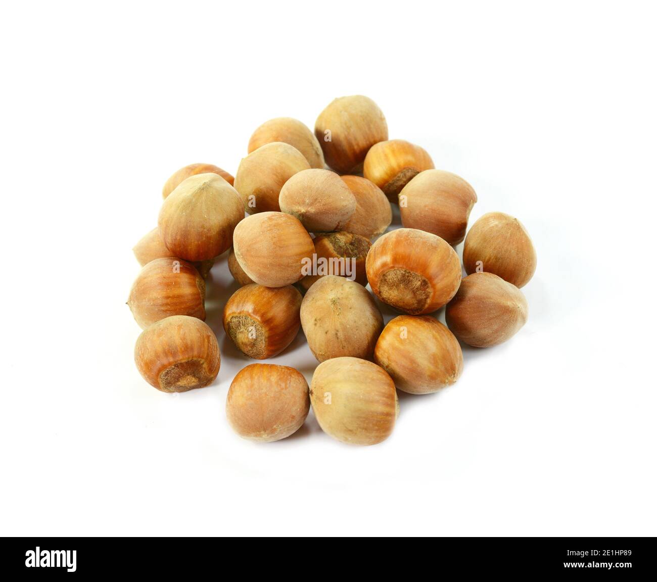 Heap of hazelnuts isolated on white background Stock Photo - Alamy