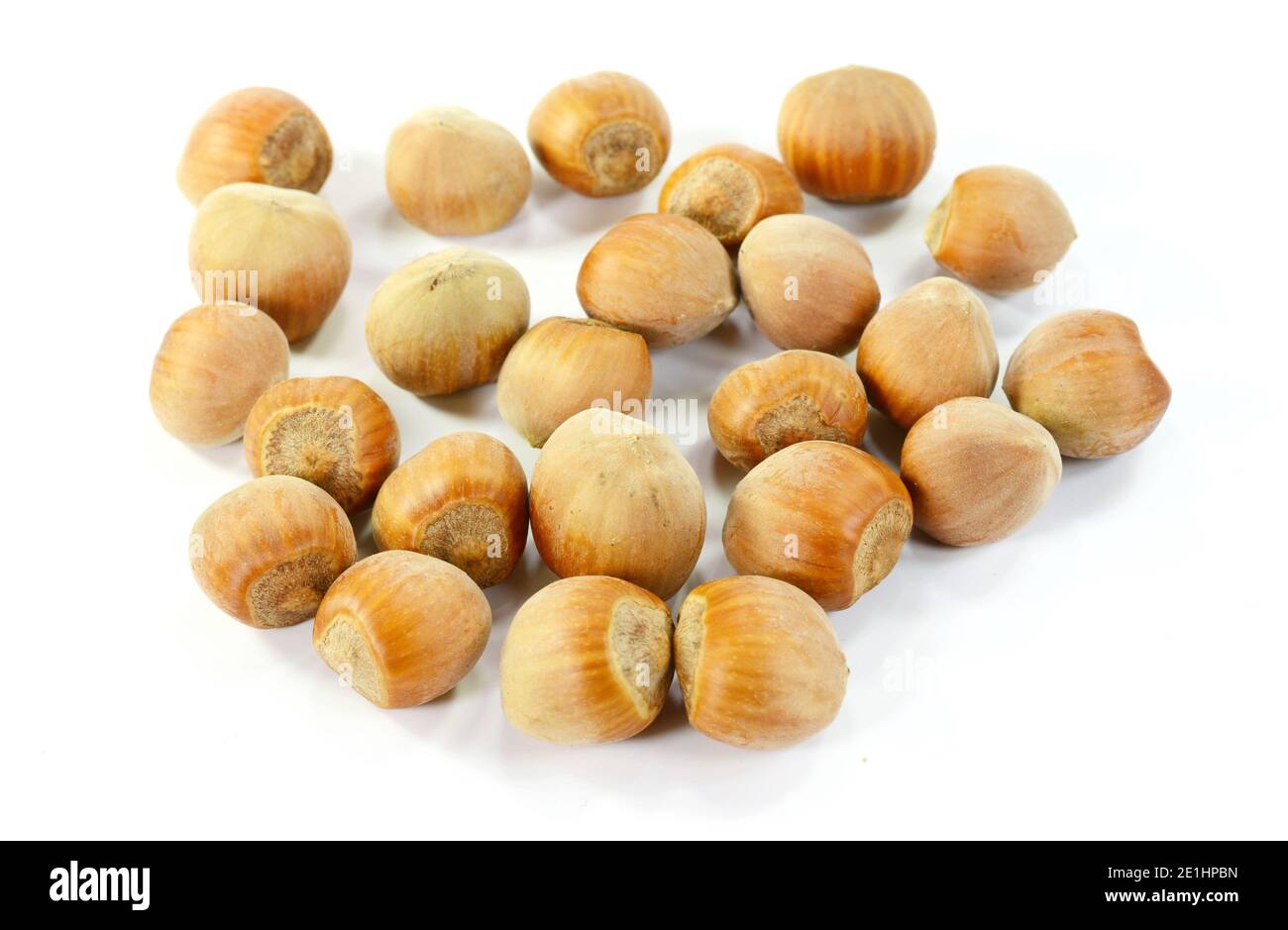Heap of hazelnuts isolated on white background Stock Photo - Alamy
