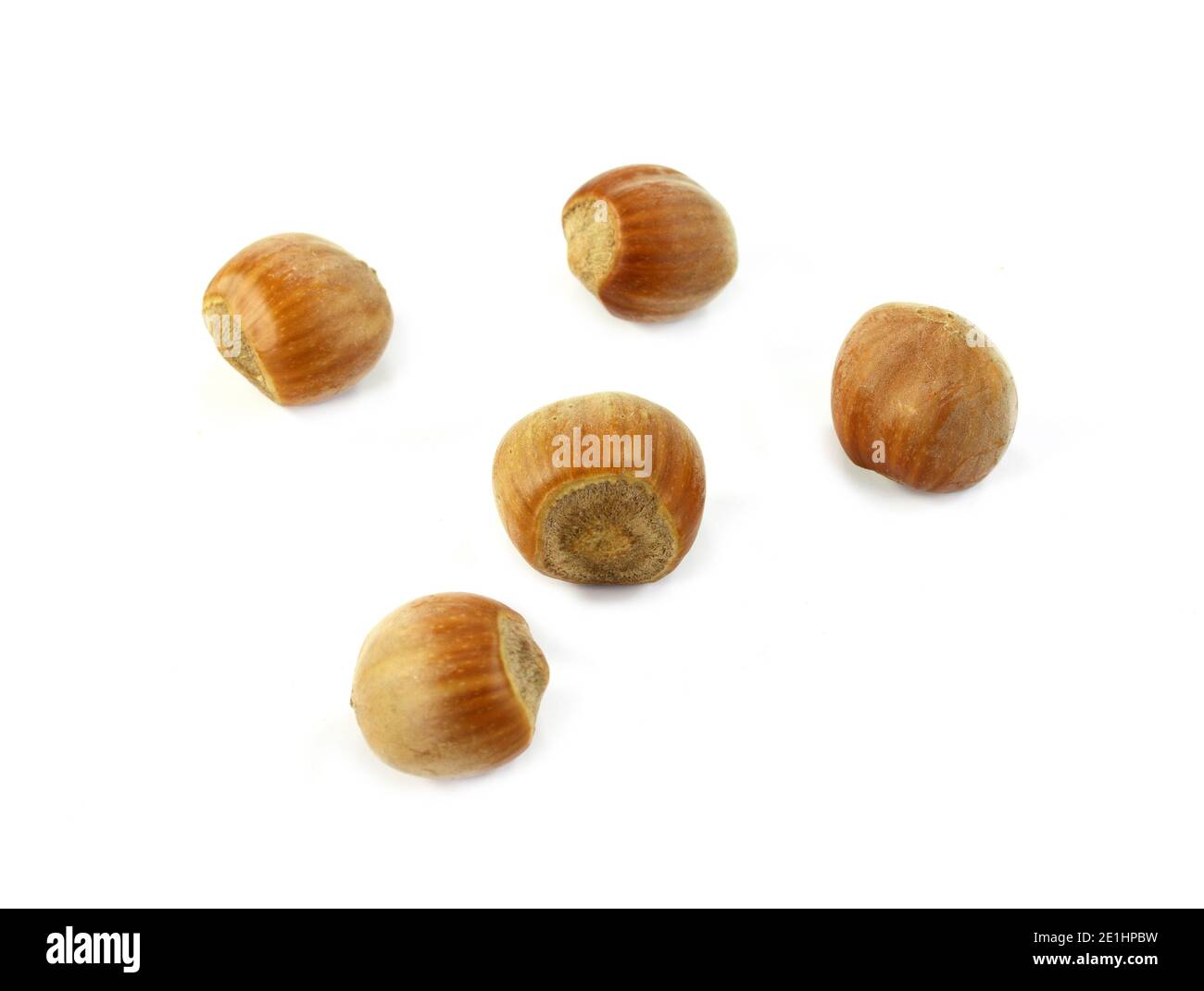 Heap of hazelnuts isolated on white background Stock Photo - Alamy
