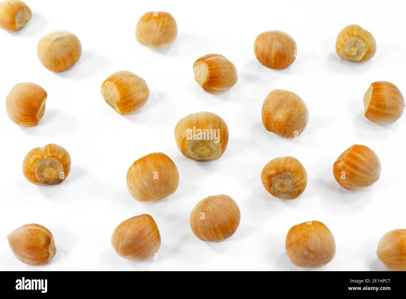 Heap of hazelnuts isolated on white background Stock Photo - Alamy