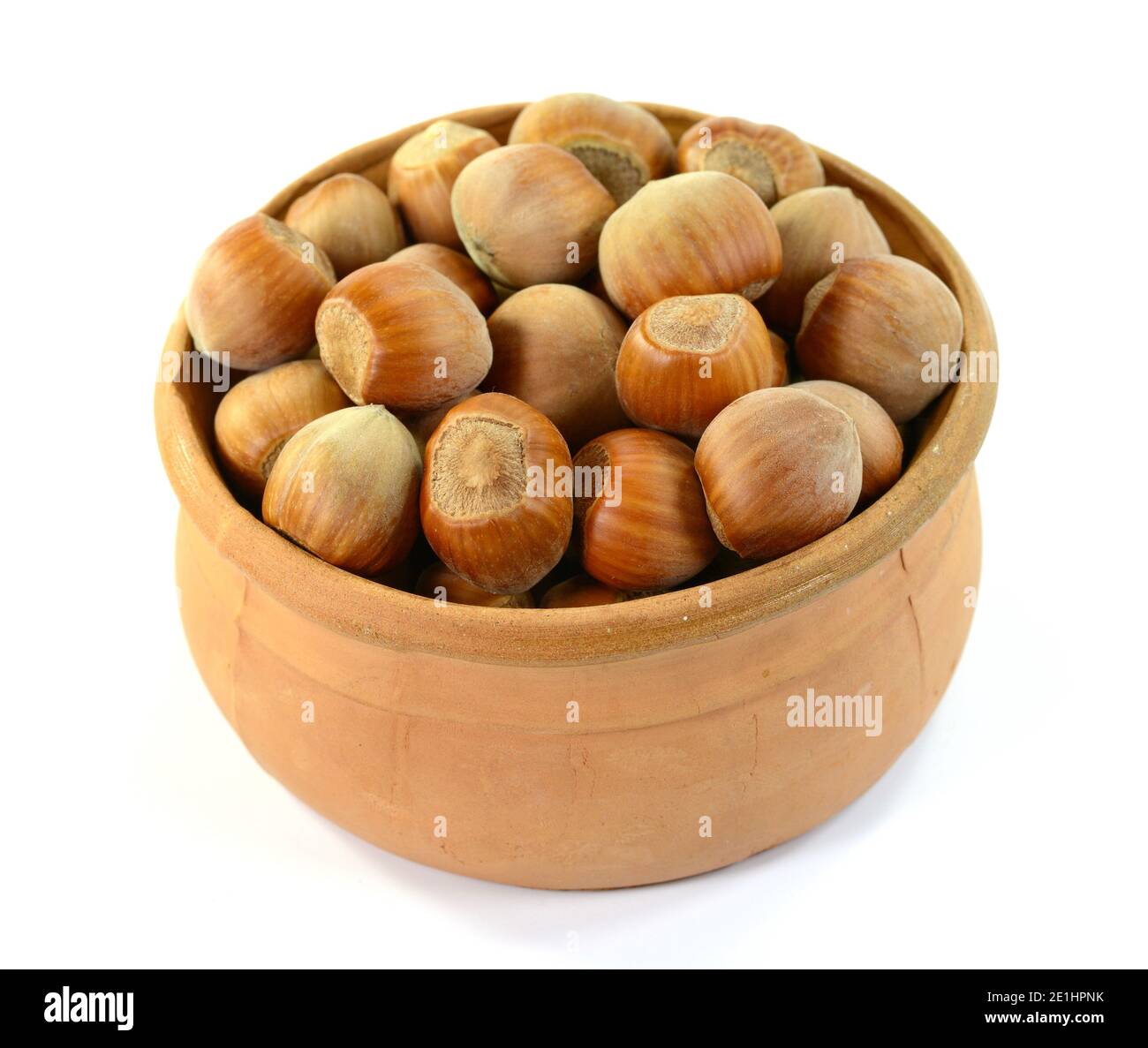 Heap of hazelnuts in a bowl isolated on white background Stock Photo ...