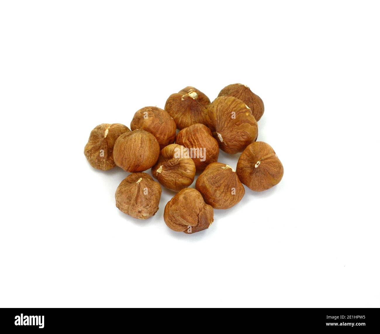 Heap of hazelnuts isolated on white background Stock Photo - Alamy