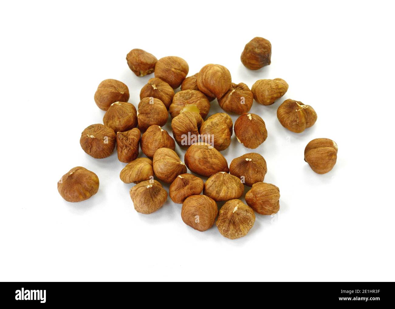 Heap of hazelnuts isolated on white background Stock Photo - Alamy
