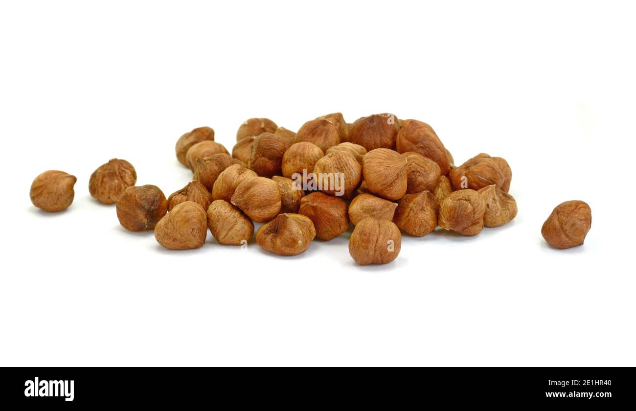 Heap of hazelnuts isolated on white background Stock Photo - Alamy