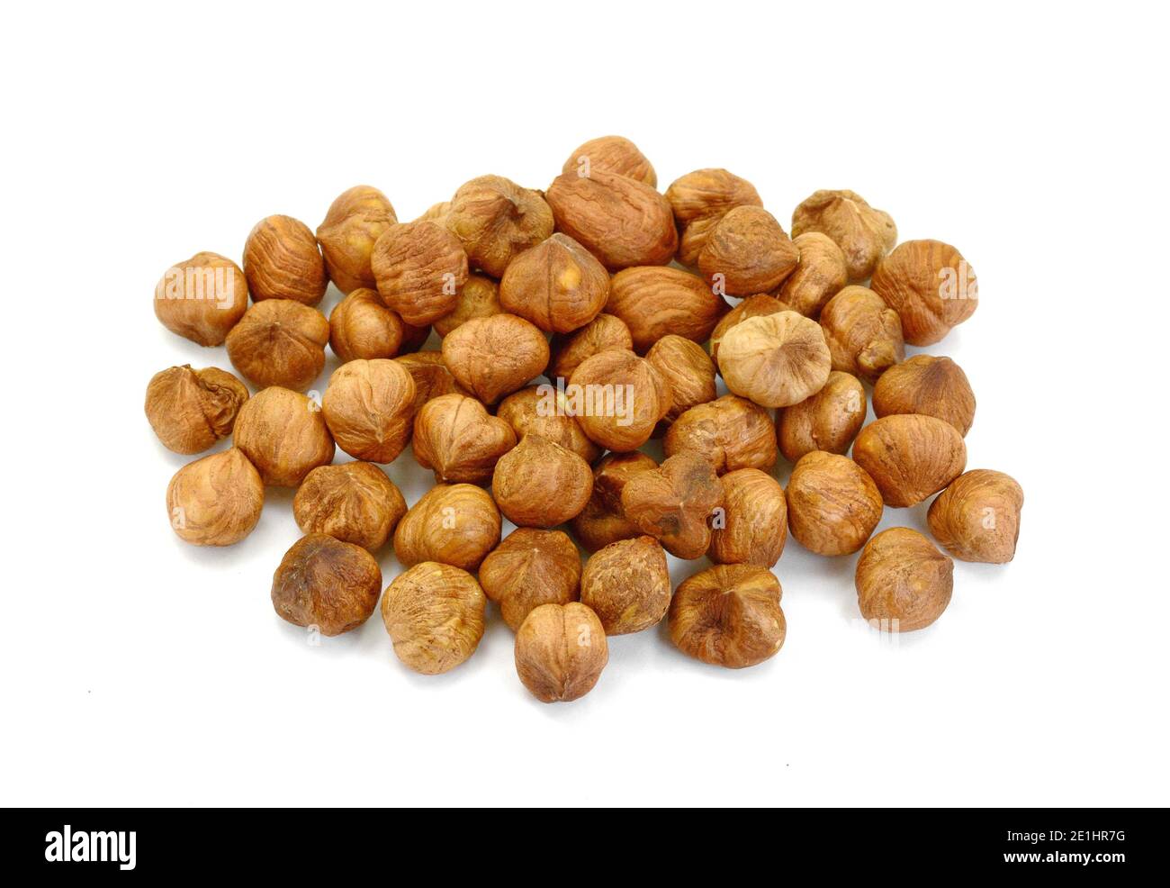 Heap of hazelnuts isolated on white background Stock Photo - Alamy