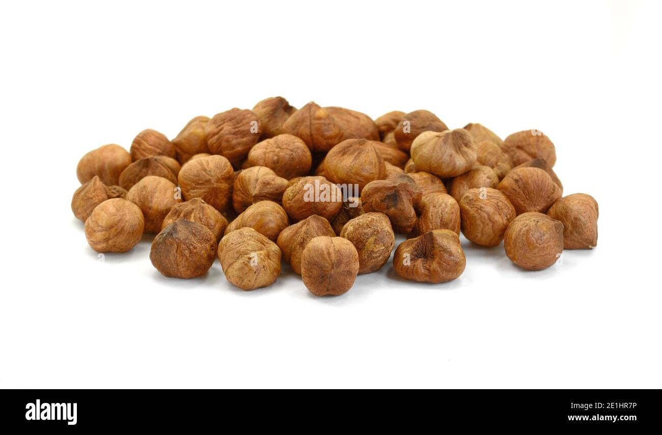 Heap of hazelnuts isolated on white background Stock Photo - Alamy