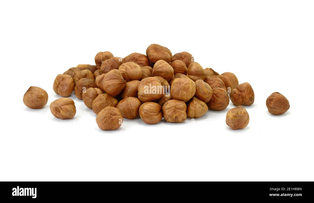 Heap of hazelnuts isolated on white background Stock Photo - Alamy