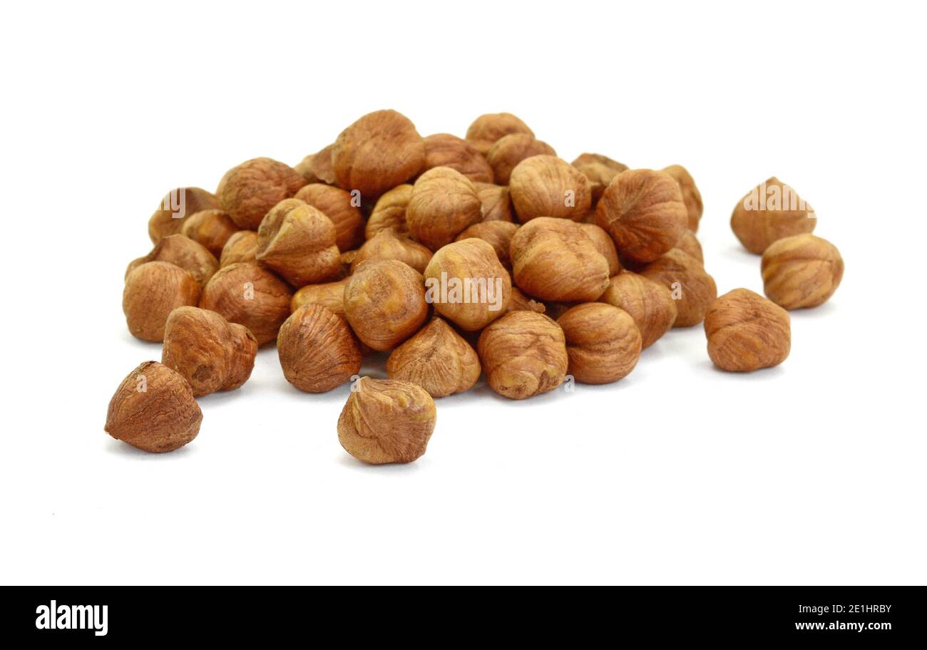 Heap of hazelnuts isolated on white background Stock Photo - Alamy