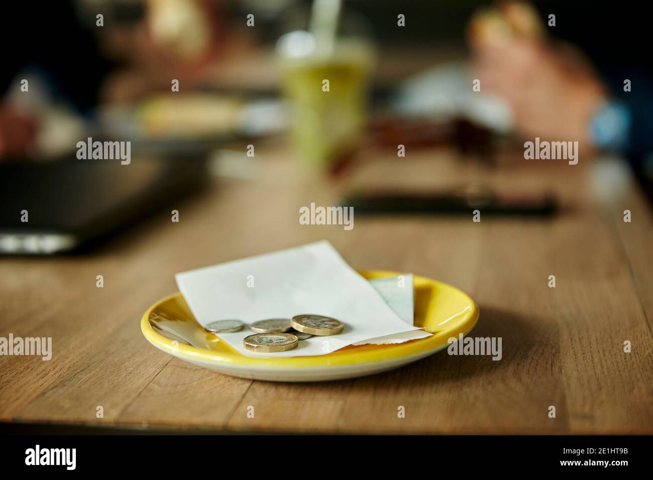 Coins and bill on restaurant table Stock Photo - Alamy