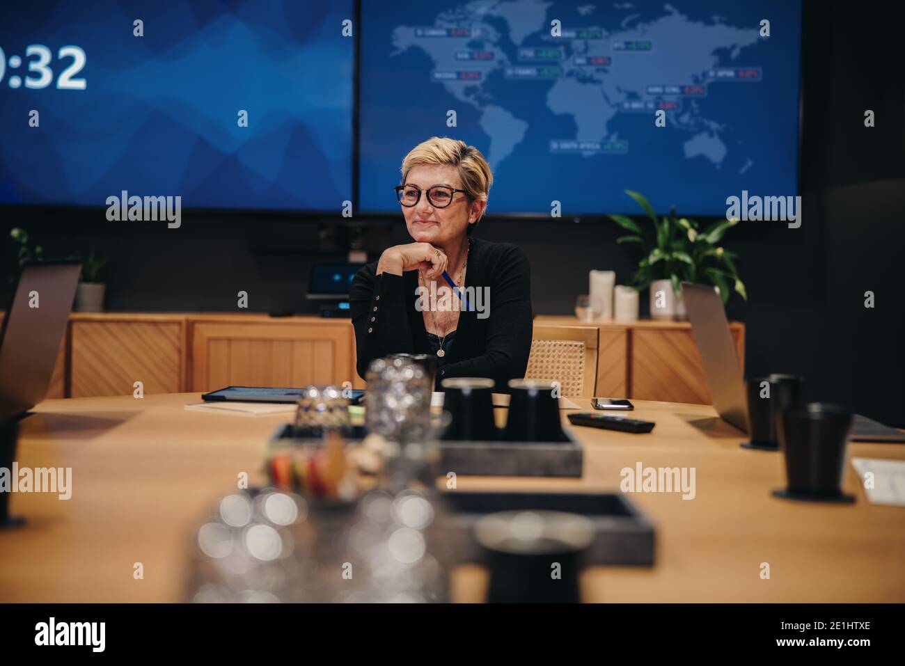 Female manager sitting at boardroom for meeting. CEO in boardroom ...