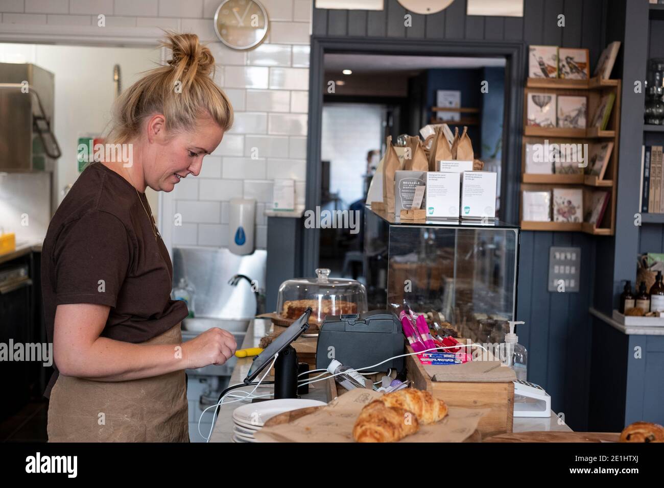 Waitress standing in a cafe hi-res stock photography and images - Alamy