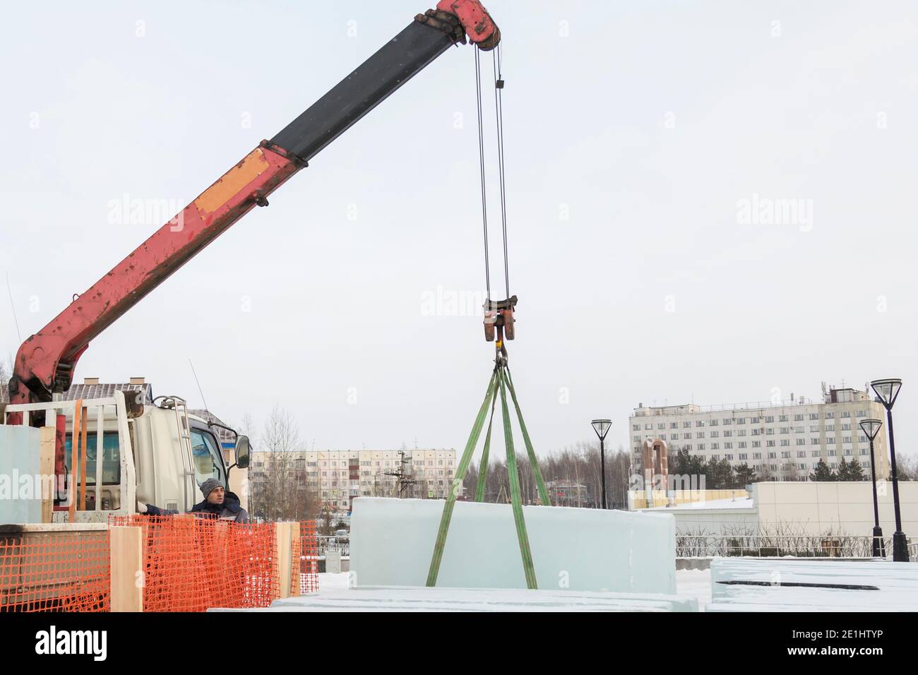 Portrait of a hydraulic crane operator loading ice panels Stock Photo ...