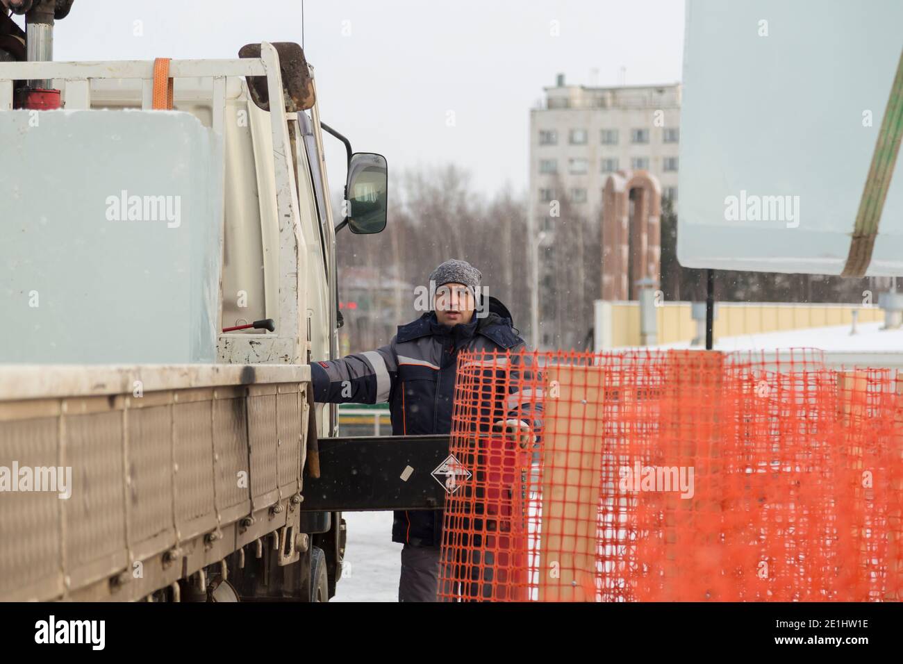 Portrait of a hydraulic crane operator loading ice panels Stock Photo ...