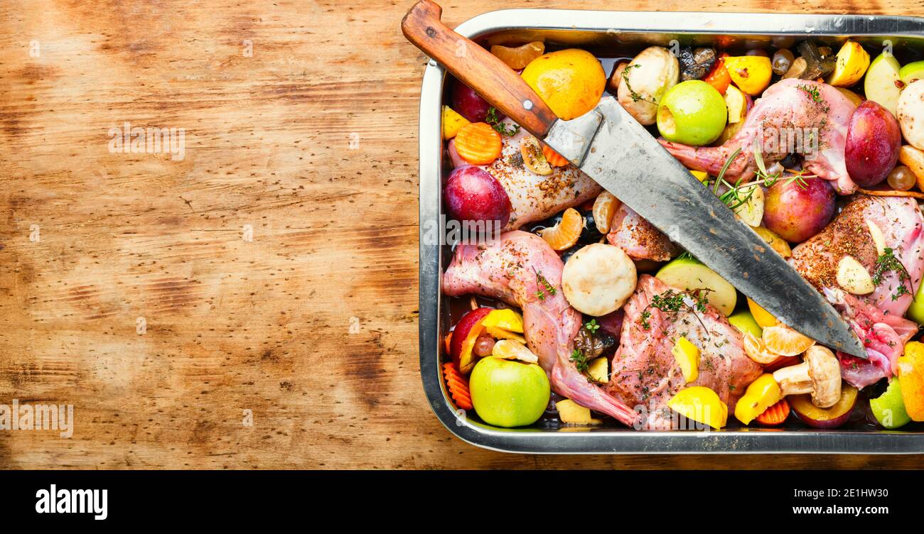 Pieces of raw rabbit meat marinated with fruit.Copy space Stock Photo ...