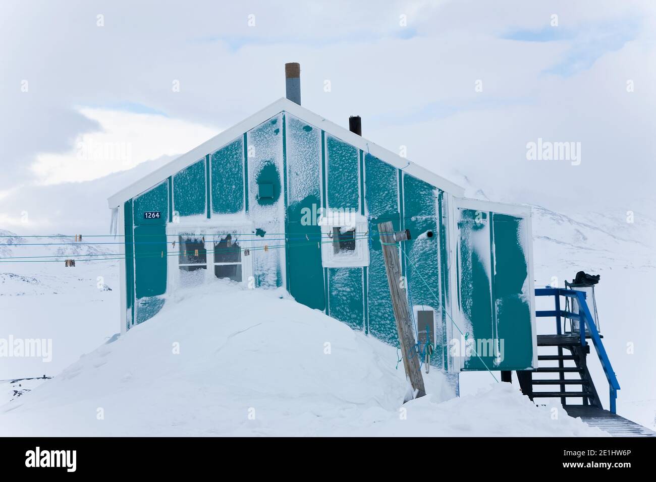House in winter covered in snow, Tasiilaq, southeastern Greenland Stock ...