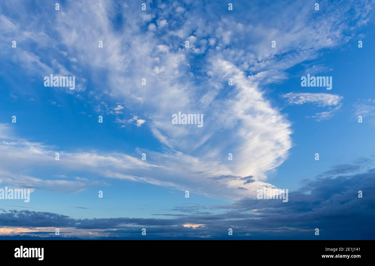 Blue sky with white picturesque clouds and dark blue mountains Stock ...