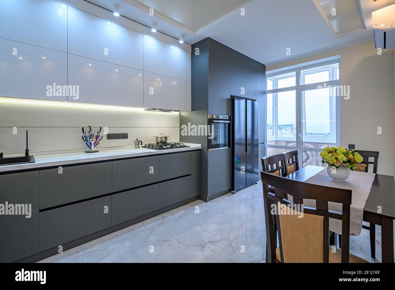 Luxury white and dark grey modern kitchen interior Stock Photo - Alamy