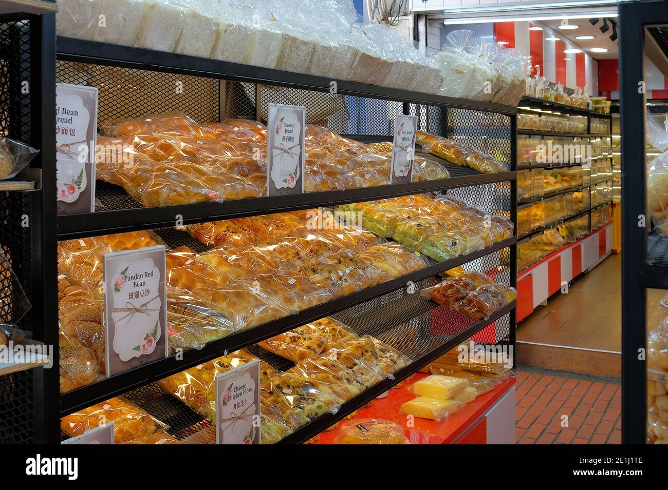 An assortment of cakes and breads for sale at a bakery. More and more ...