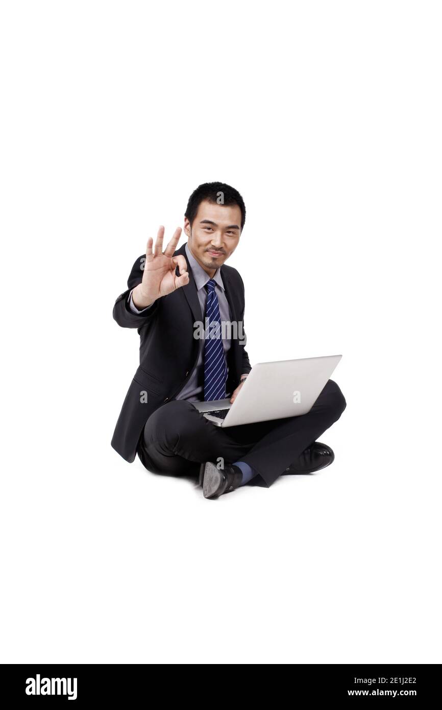 A happy young Business man using laptop high quality photo Stock Photo ...
