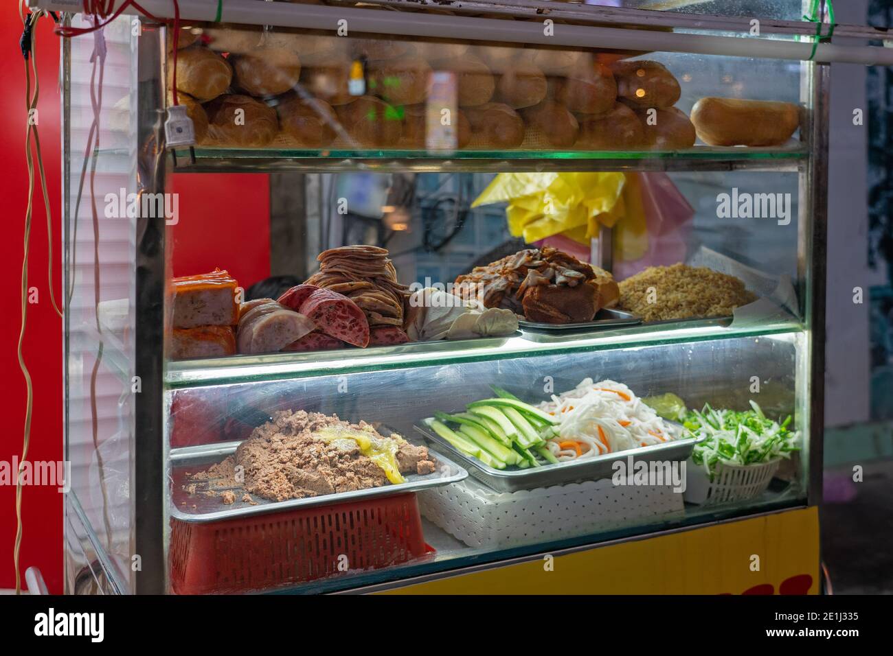 Stall with traditional street food - banh mi. Vietnamese national dish ...