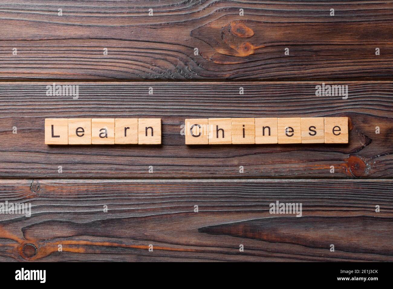Learn chinese word written on wood block. Learn chinese text on table ...