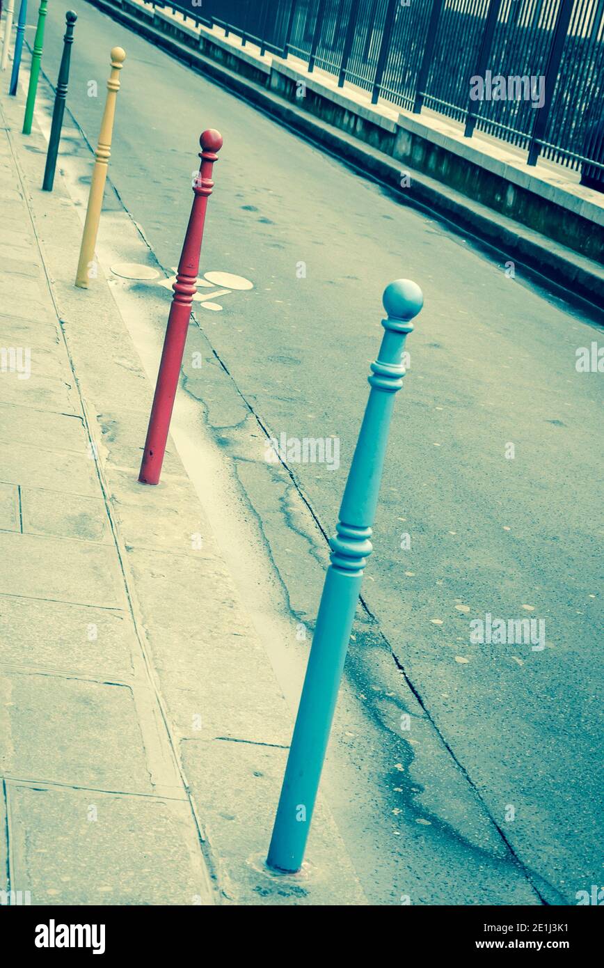 Colorful street bollards. Paris. Retro toned photo. Selective focus on ...