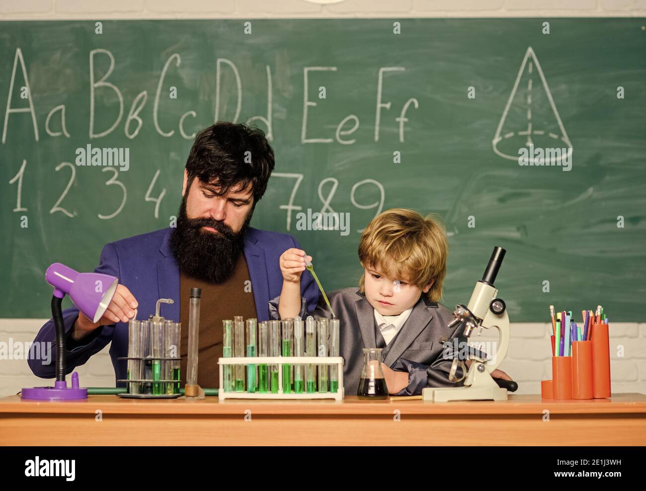 Cognitive skills. Back to school. Chemistry experiment. Teacher child ...